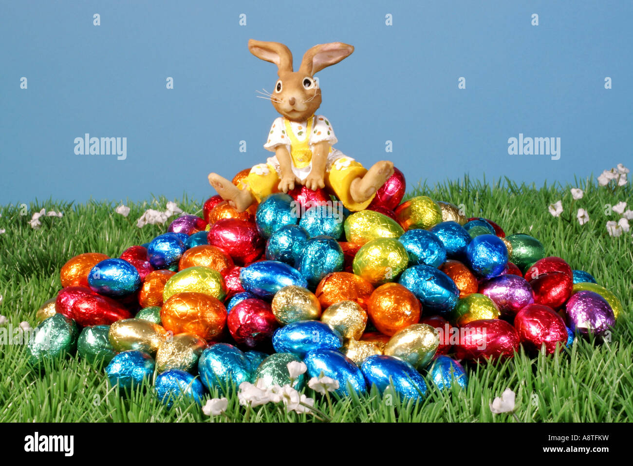 Easter bunny sitting on Easter eggs Stock Photo - Alamy