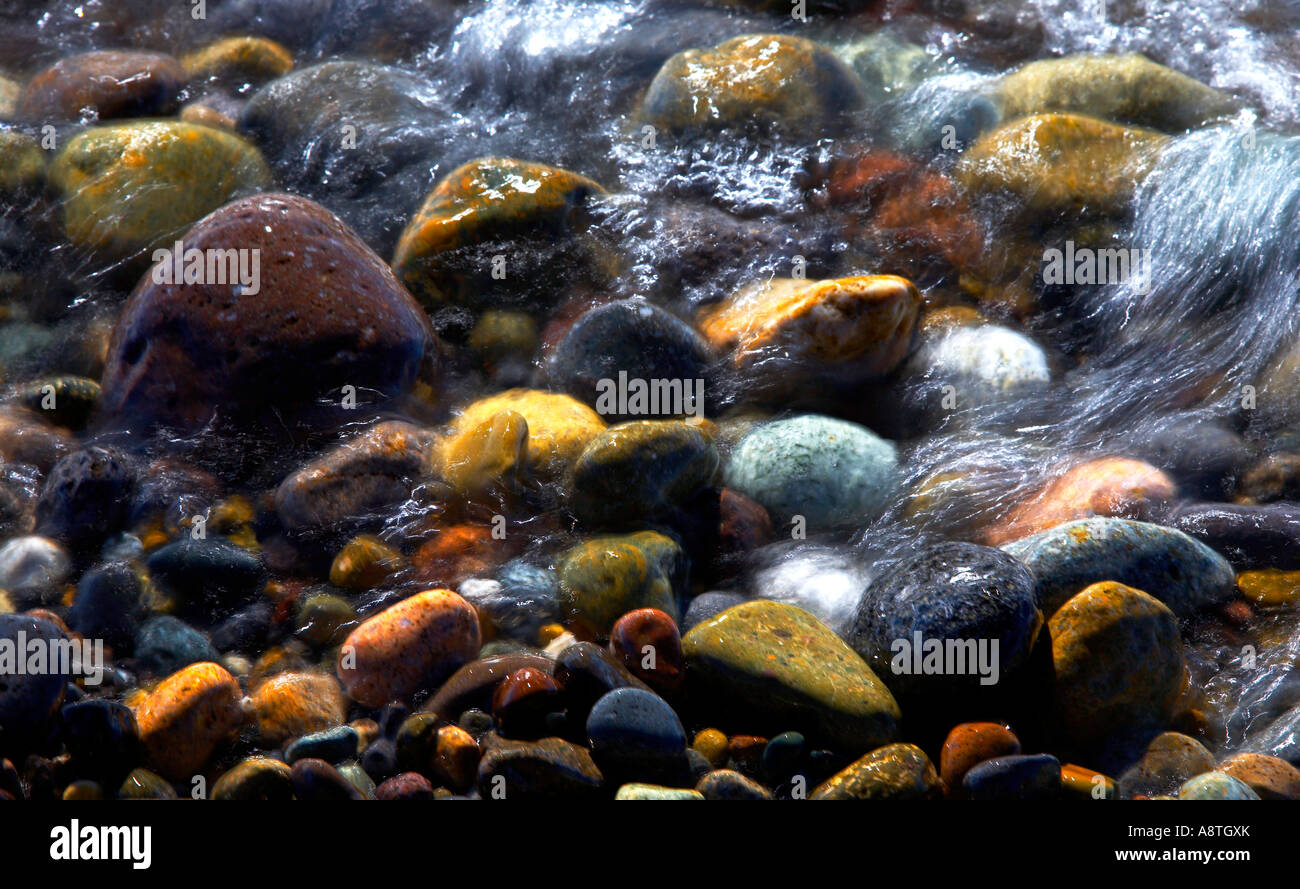 Water running over pebbles rocks hi-res stock photography and images ...