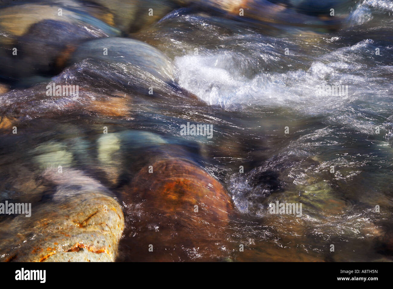 Water running over pebbles rocks hi-res stock photography and images ...