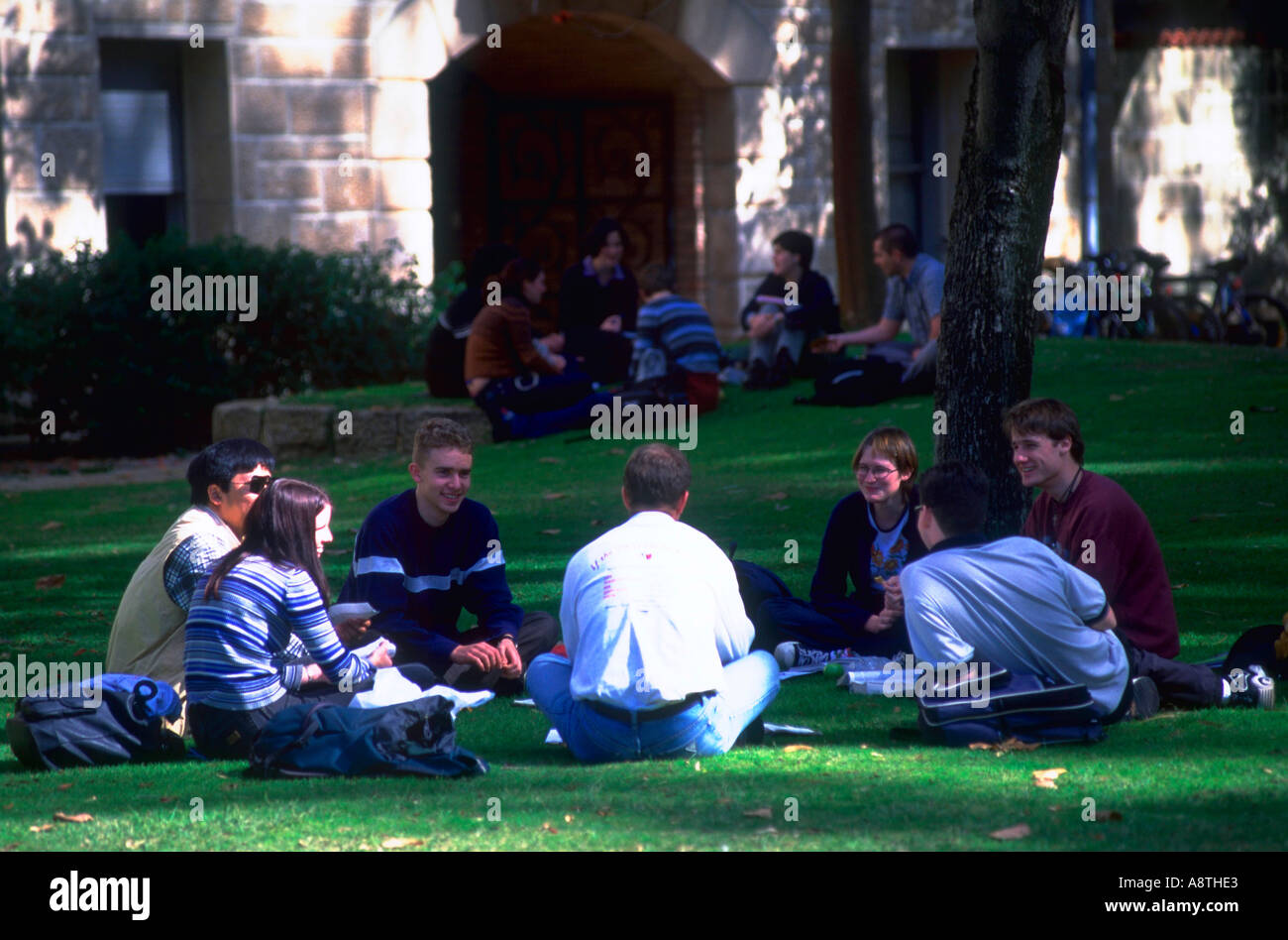 Students sitting on the lawn outside the University of Western ...