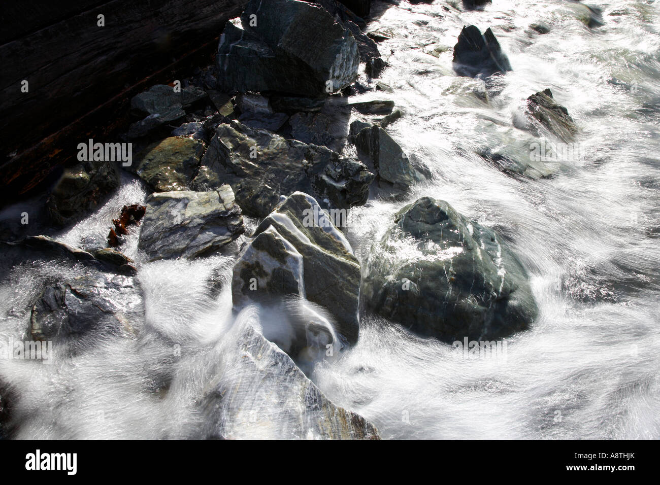 waves hitting rocky shore Stock Photo - Alamy
