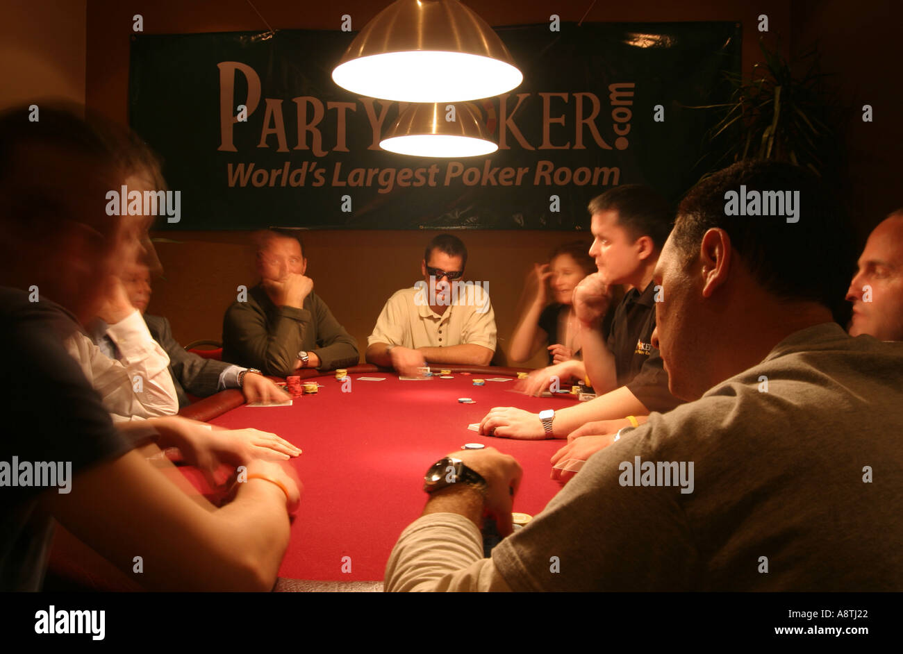 A poker game in progress The dealer is dealing the cards Partpoker com ...