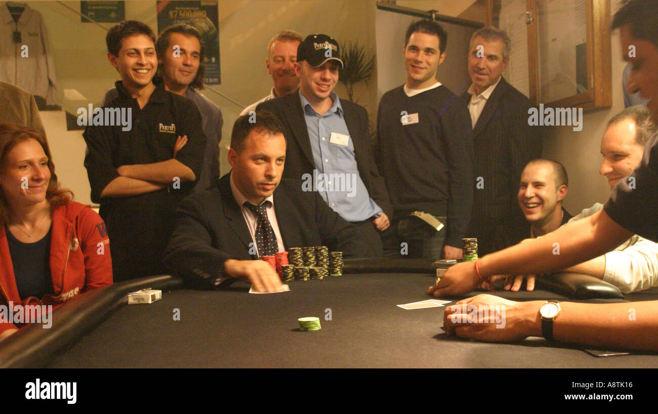 A poker game in progress The dealer is dealing the cards Stock Photo ...