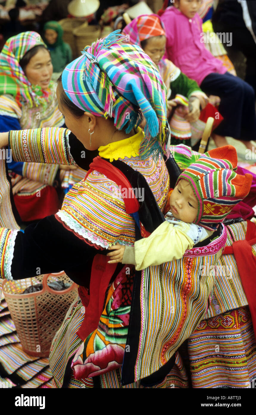 Mother carrying traditional baby carrier hi-res stock photography and ...