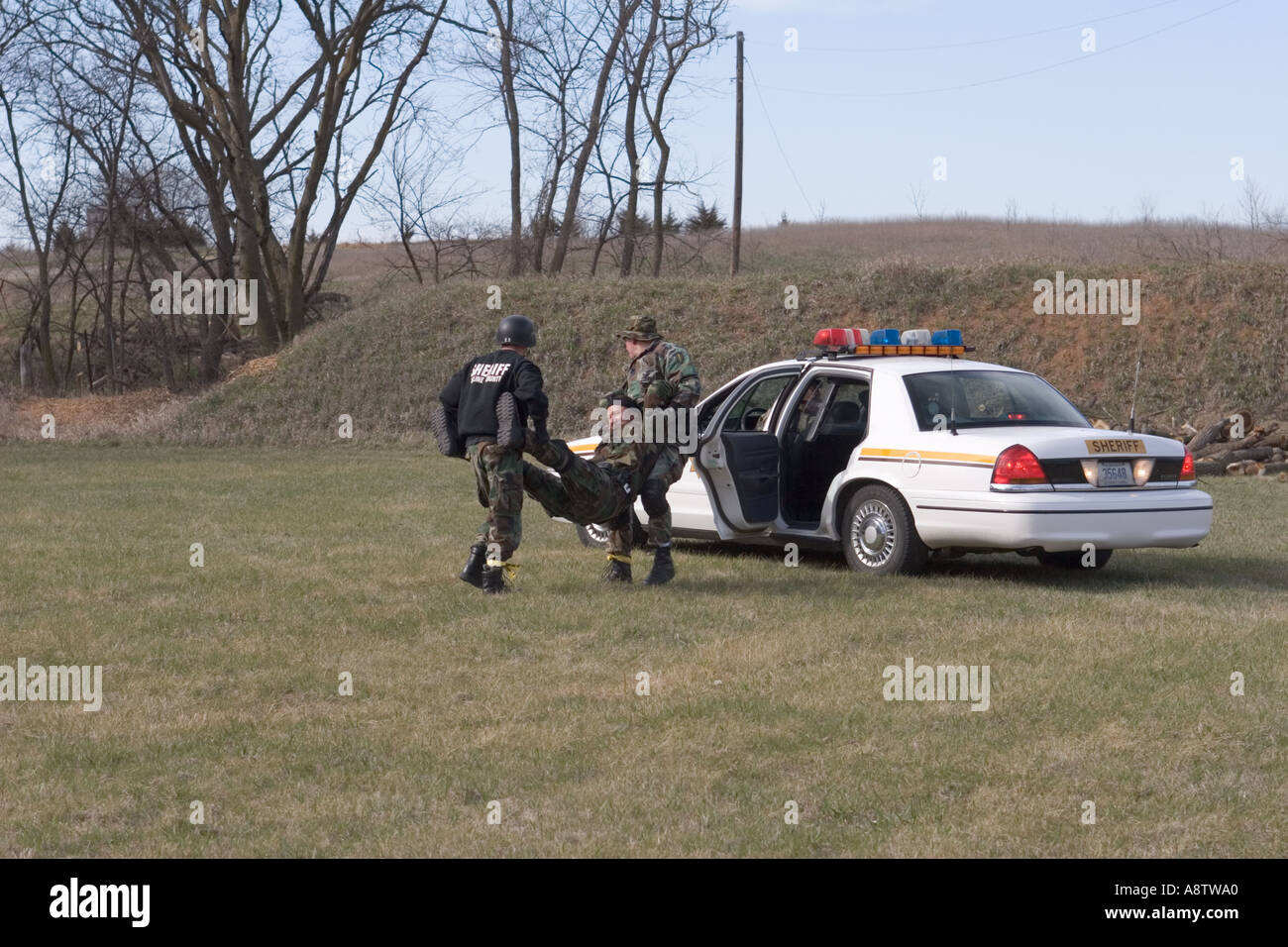 SWAT team training Retreiving injured officer from line of fire hot ...