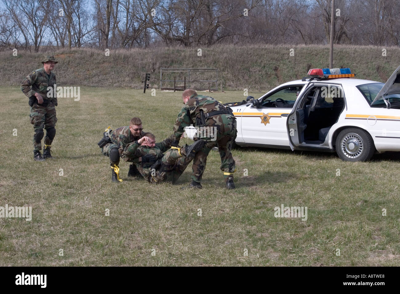 SWAT team training Retreiving injured officer from line of fire hot ...
