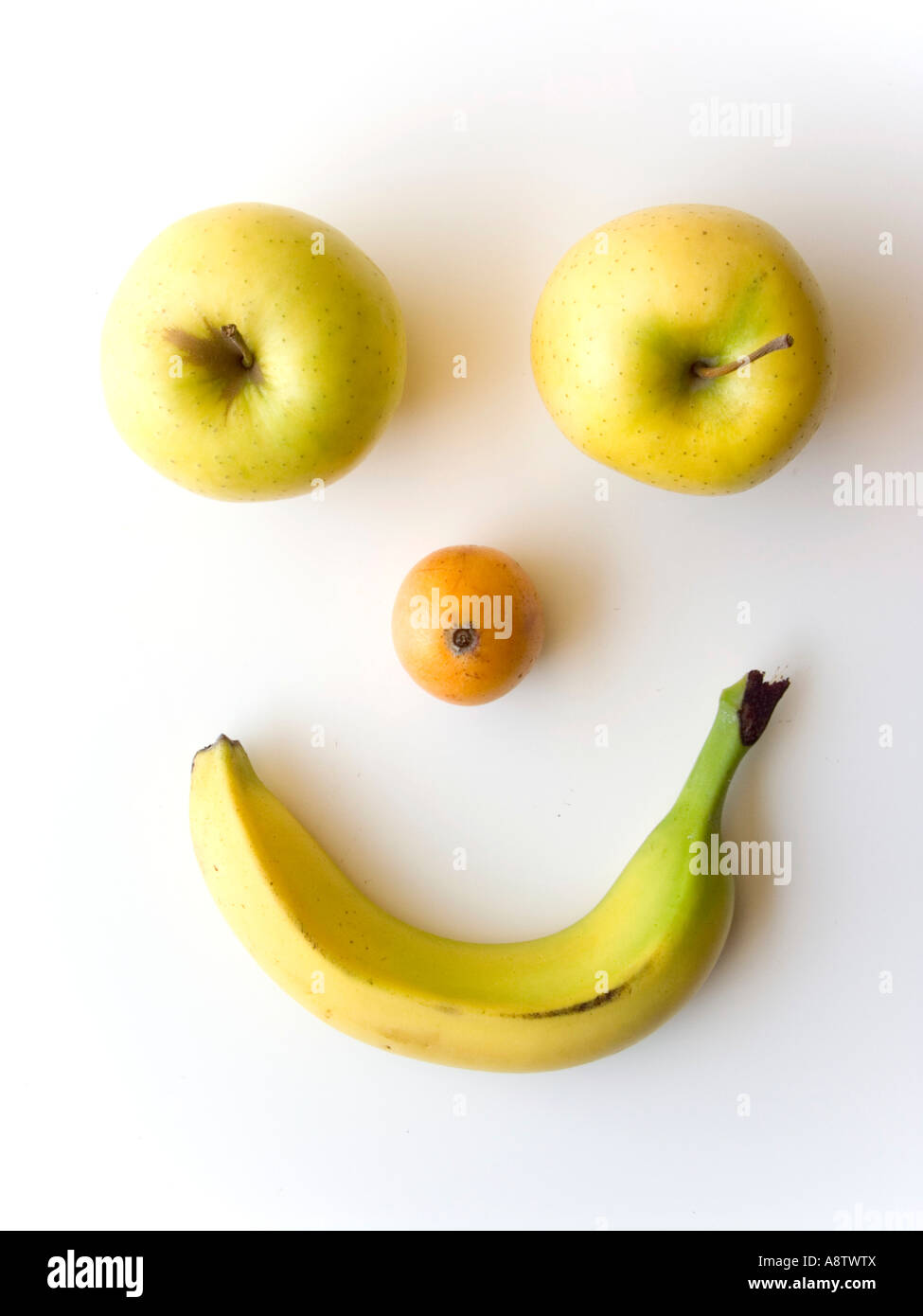 apple apricot loquat and banana composition showing smile face Stock ...