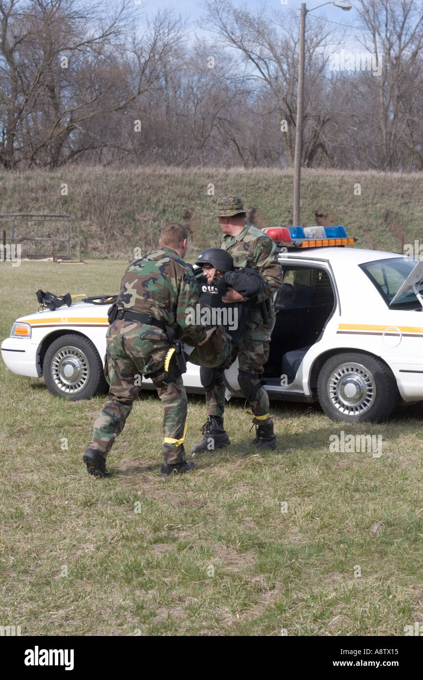 SWAT team training Retreiving injured officer from line of fire hot ...
