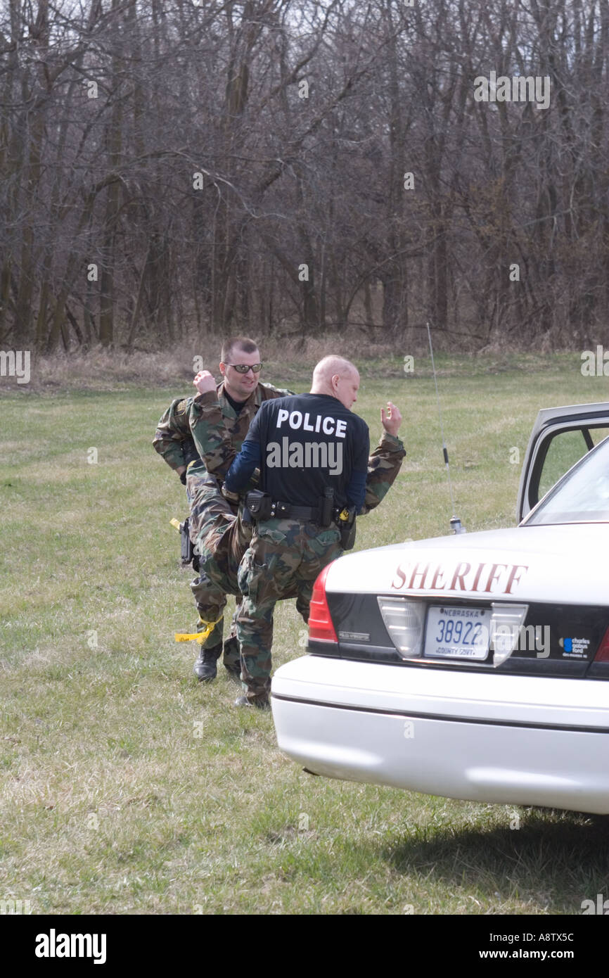 SWAT team training Retreiving injured officer from line of fire hot ...