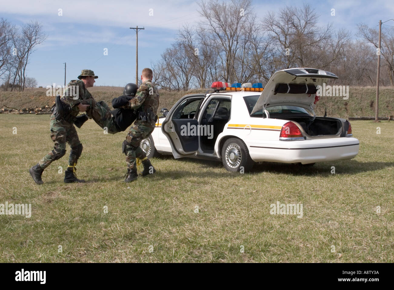 SWAT team training Retreiving injured officer from line of fire hot ...