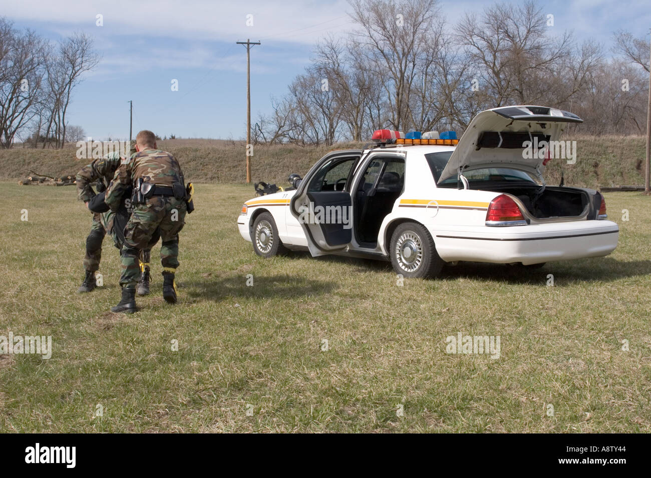 SWAT team training Retreiving injured officer from line of fire hot ...