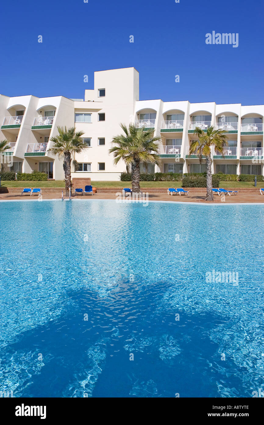 Beautiful blue swimming pool in Spanish hotel with palm trees Stock ...