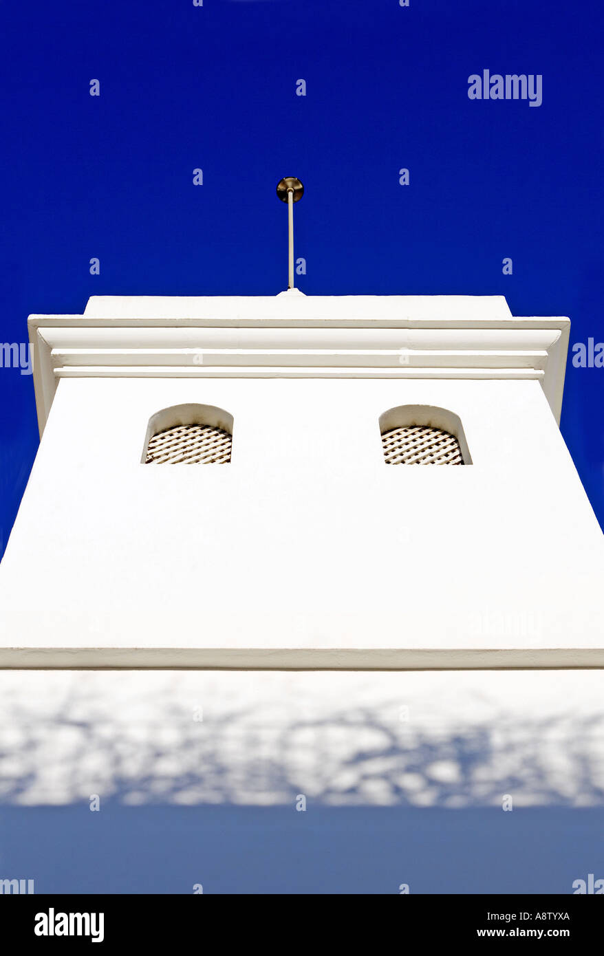 Plain white tower in traditional Pueblo on the Costa del Sol in Spain ...