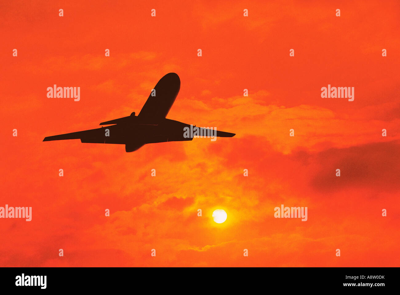 Aviation. Passenger jet aircraft flying into sunset Stock Photo - Alamy