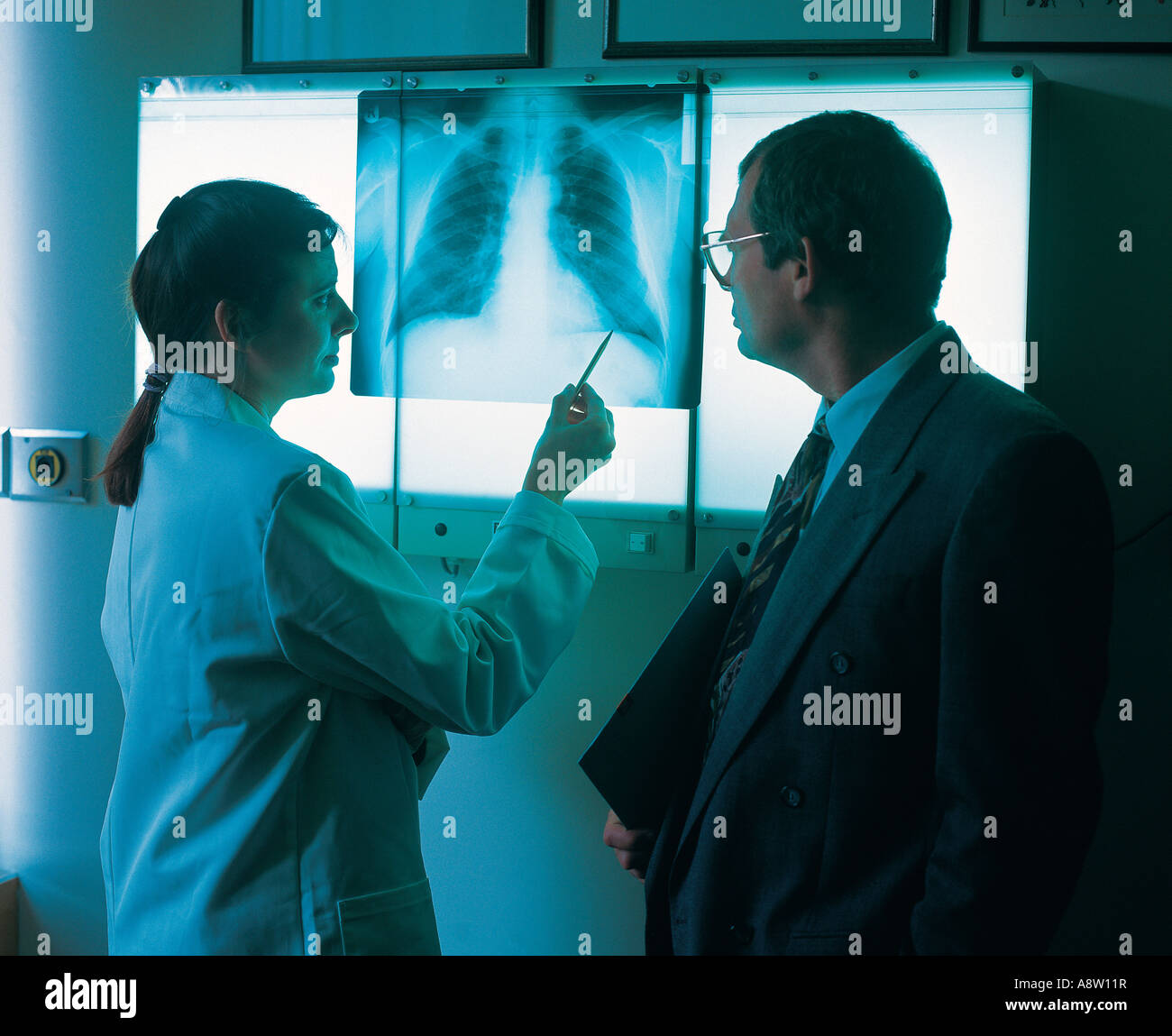 Radiography. Hospital doctor and consultant viewing chest X-ray Stock ...