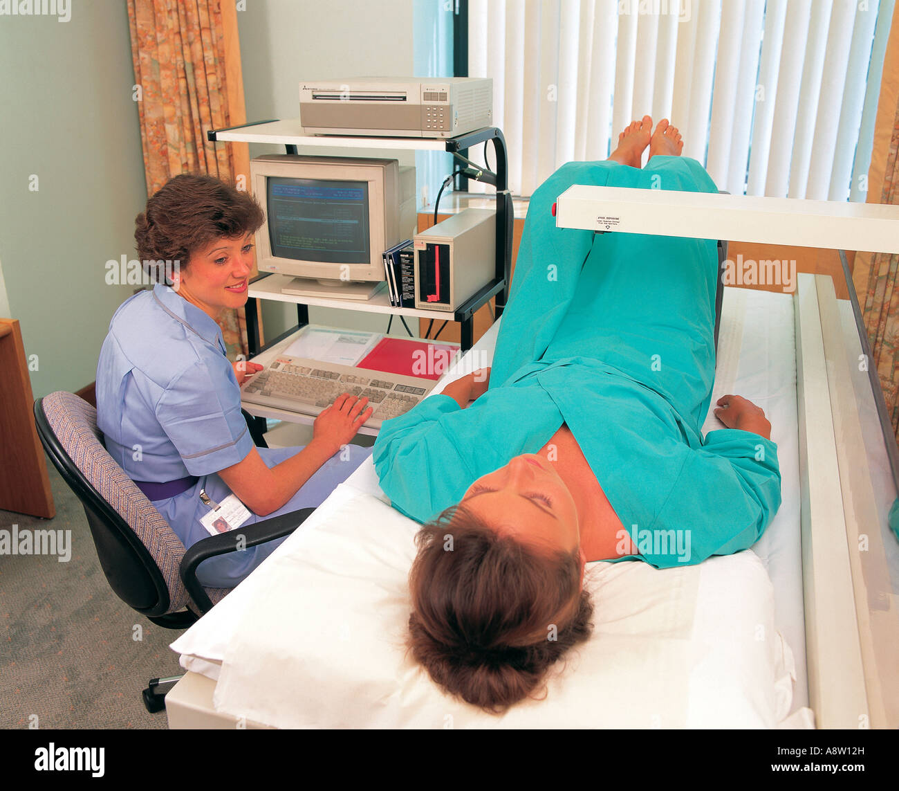 Hospital. Scanning. Diagnostic imaging. Bone densitometry. Female nurse ...