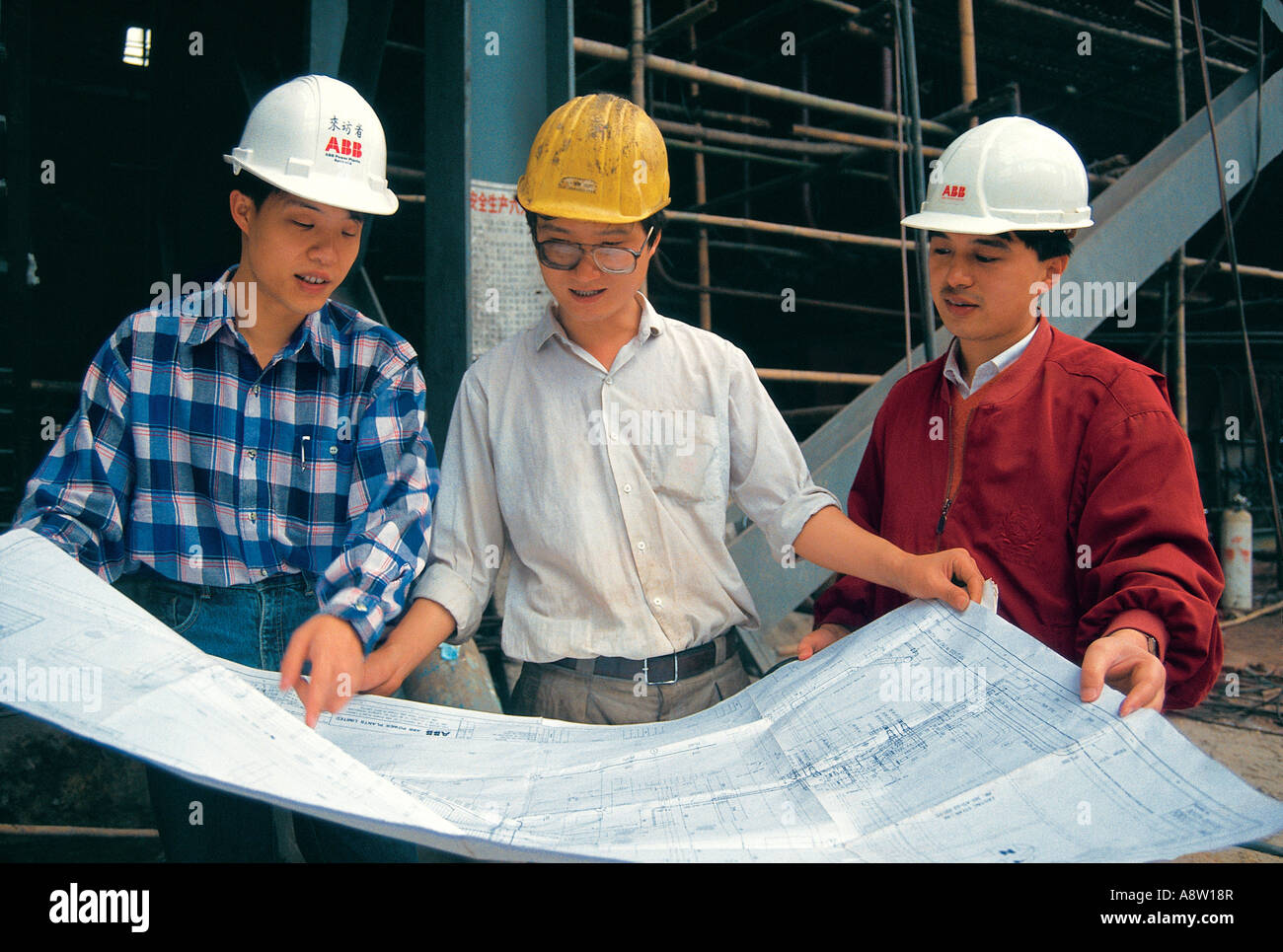 Three men construction site engineers. Guangzhou. China Stock Photo - Alamy