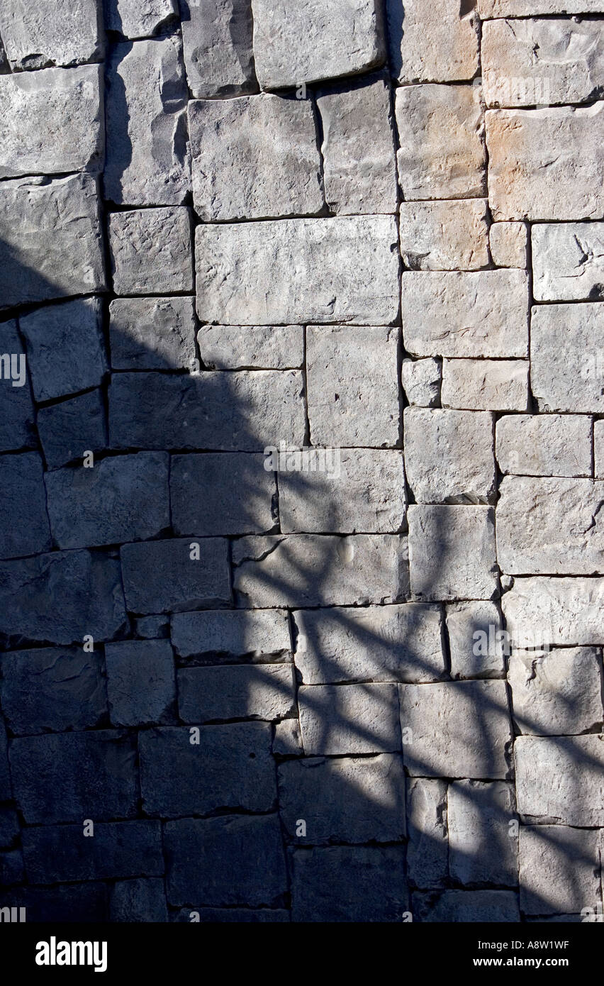 Deep sunny shadows on a large tiled stone wall Stock Photo - Alamy