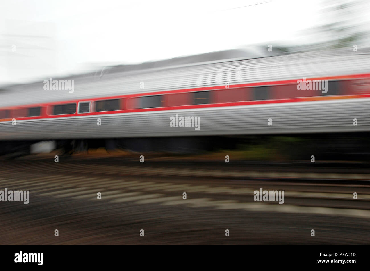 speeding commuter train rail travel railroad Stock Photo - Alamy