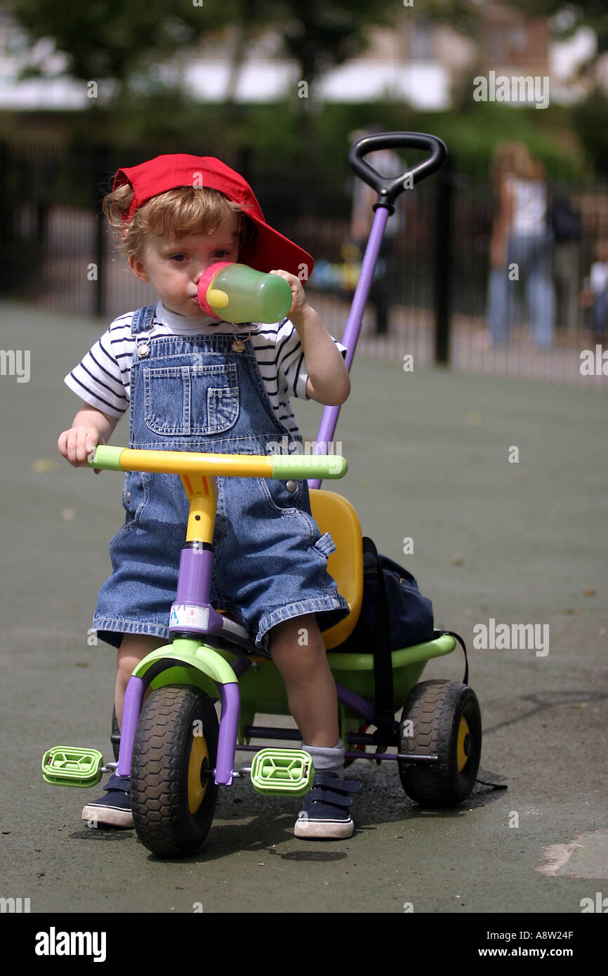 Boy on tricycle hi-res stock photography and images - Alamy