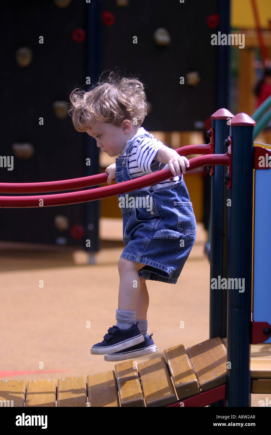 boy aged three in Arnot Park on the climbing frame Stock Photo - Alamy
