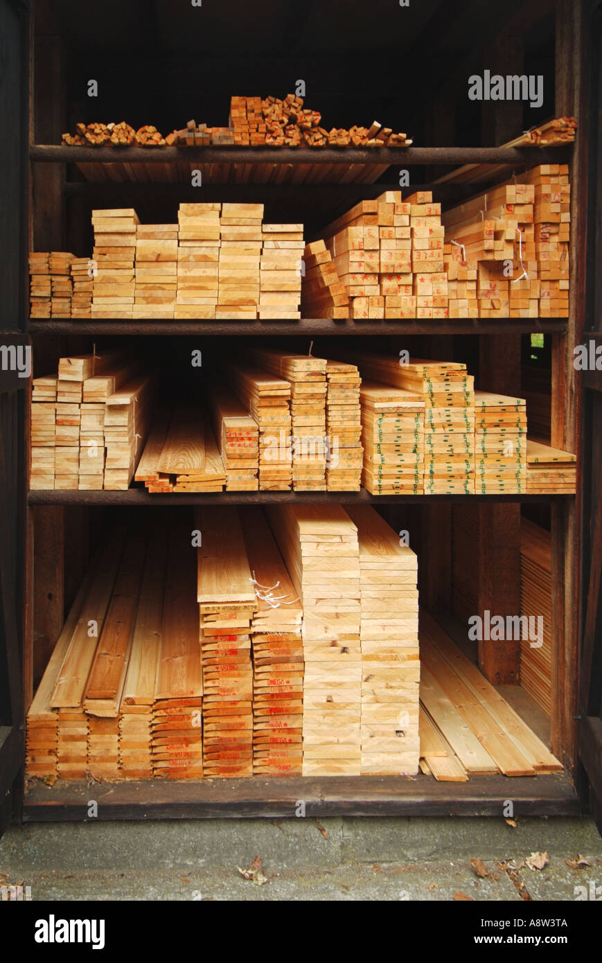 Timber yard with prepared wrot timber in racks awaiting selection and ...