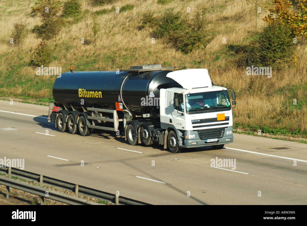M25 motorway" Bitumen tanker lorry with raised tyre saving wheels ...