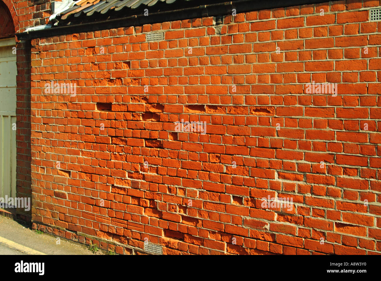 Aldeburgh brick wall showing deterioration in bricks forming an ...
