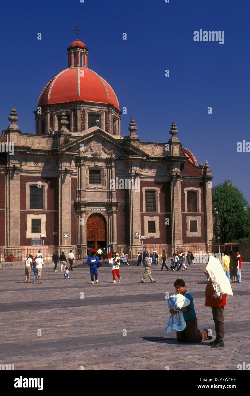 Mexican, father holding baby, pilgrims, genuflecting, at prayer, Old ...