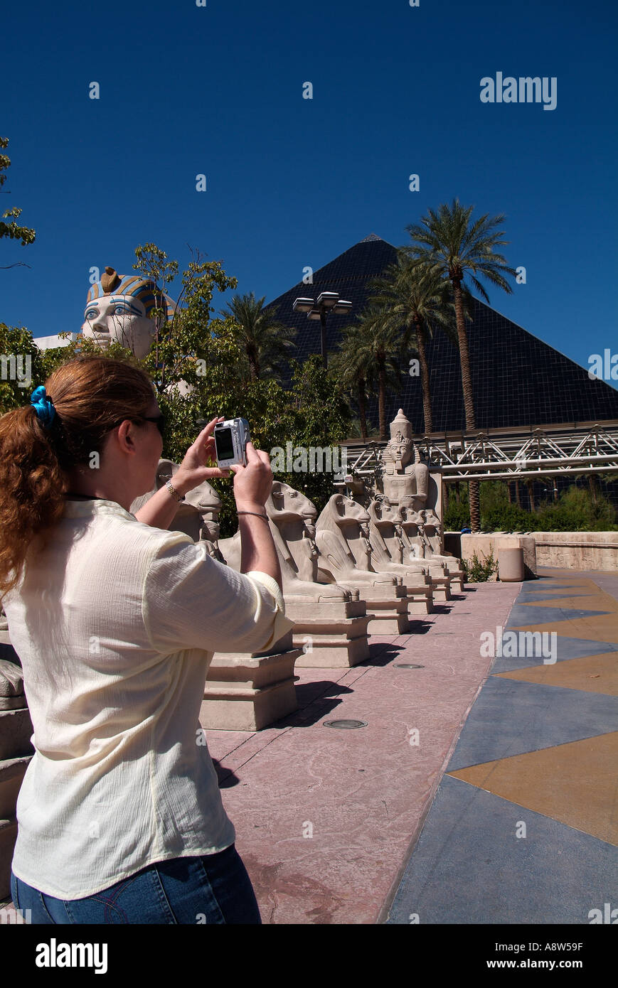 This tourist is trying to capture the enormous size of the Luxor ...