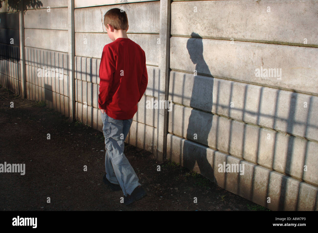 Boy Casting A Shadow Stock Photo - Alamy
