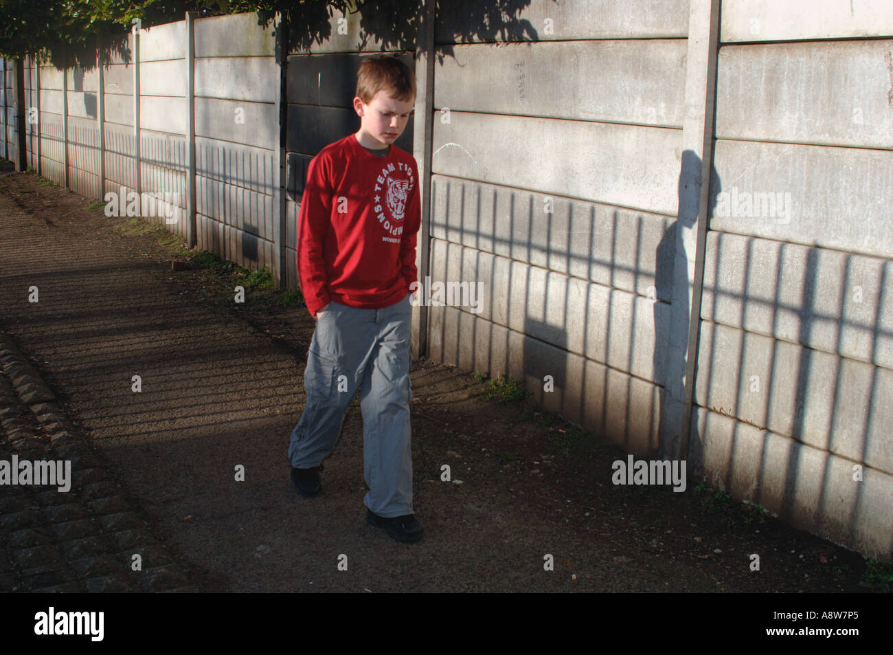 Boy Casting A Shadow Stock Photo - Alamy
