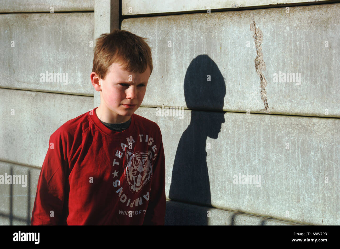 Boy Casting A Shadow Stock Photo - Alamy