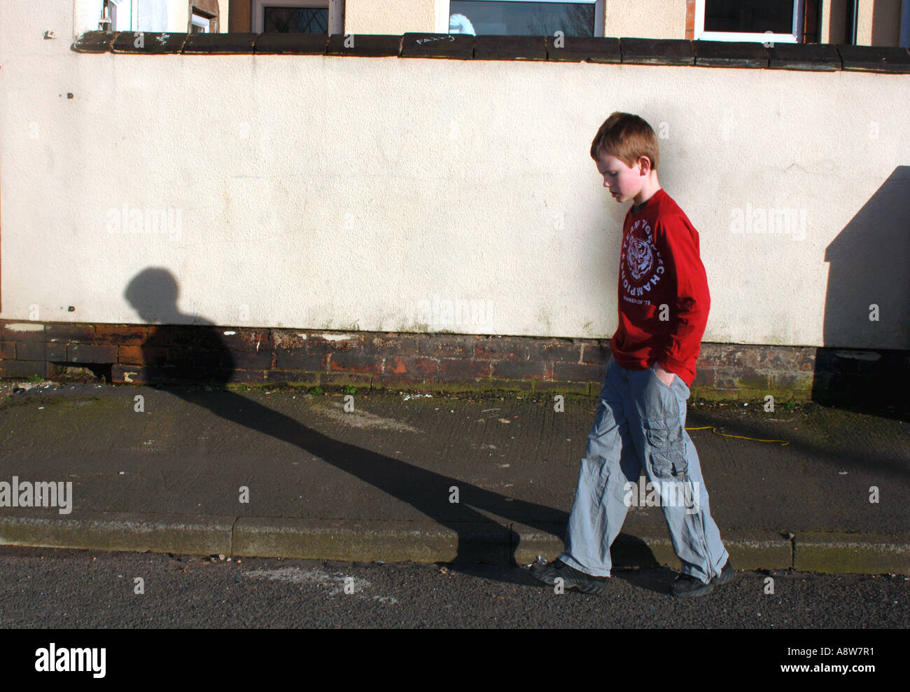 Boy Casting A Shadow Stock Photo - Alamy