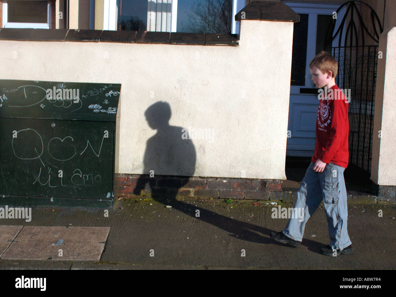 Boy Casting A Shadow Stock Photo - Alamy