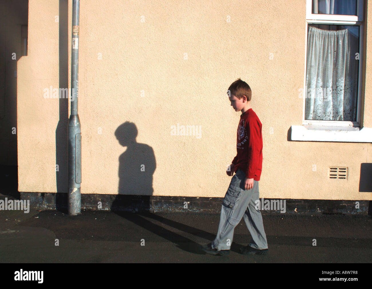 Boy Casting A Shadow Stock Photo - Alamy