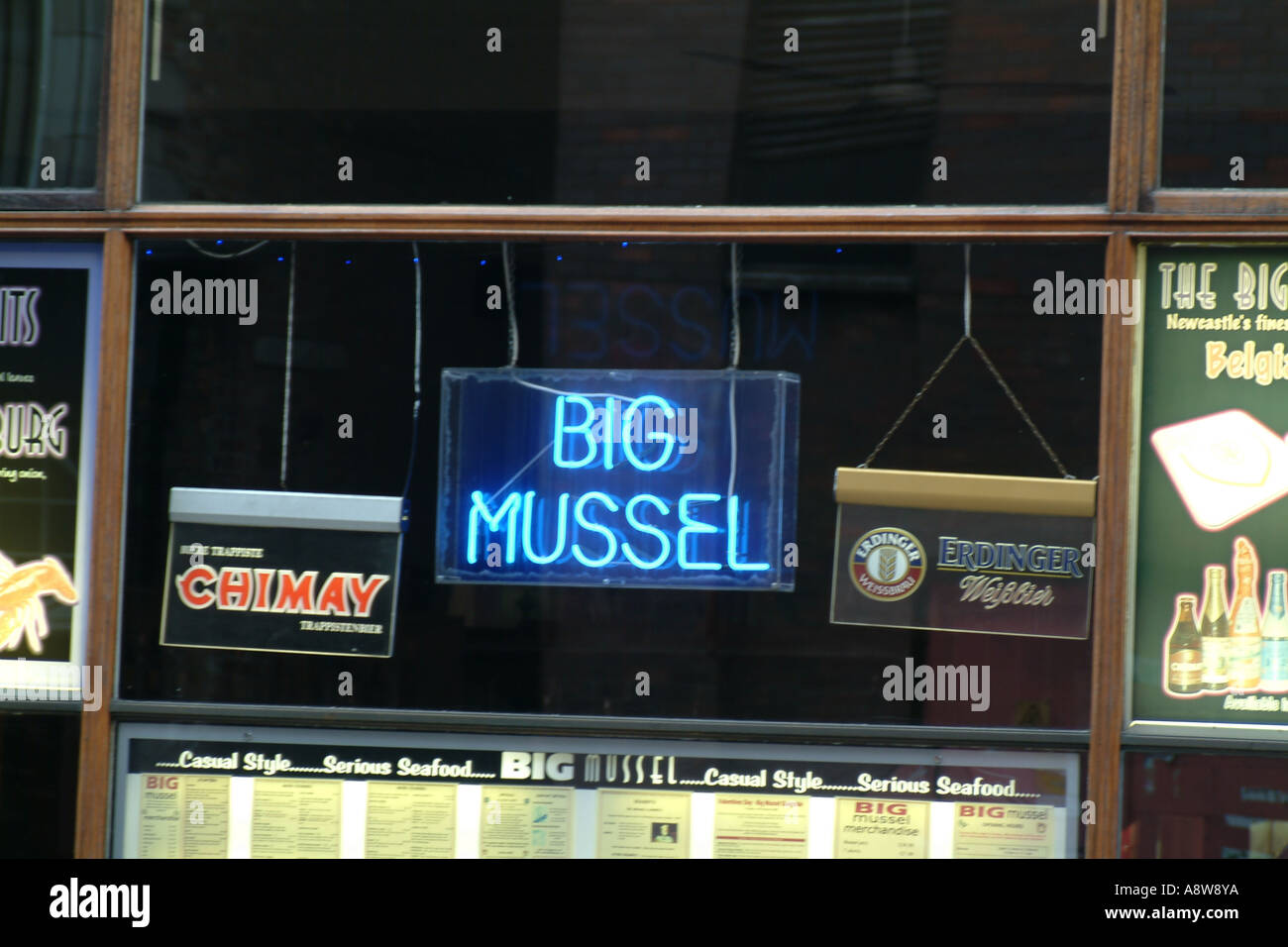 Big Mussel, blue neon shop window sign for seafood Stock Photo - Alamy