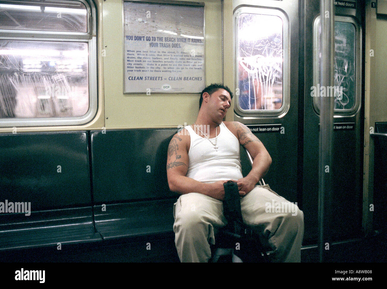 A commuter sleeps on the E train Stock Photo - Alamy
