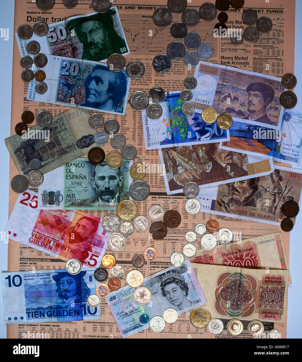 Various currencies on Financial Times background Stock Photo - Alamy
