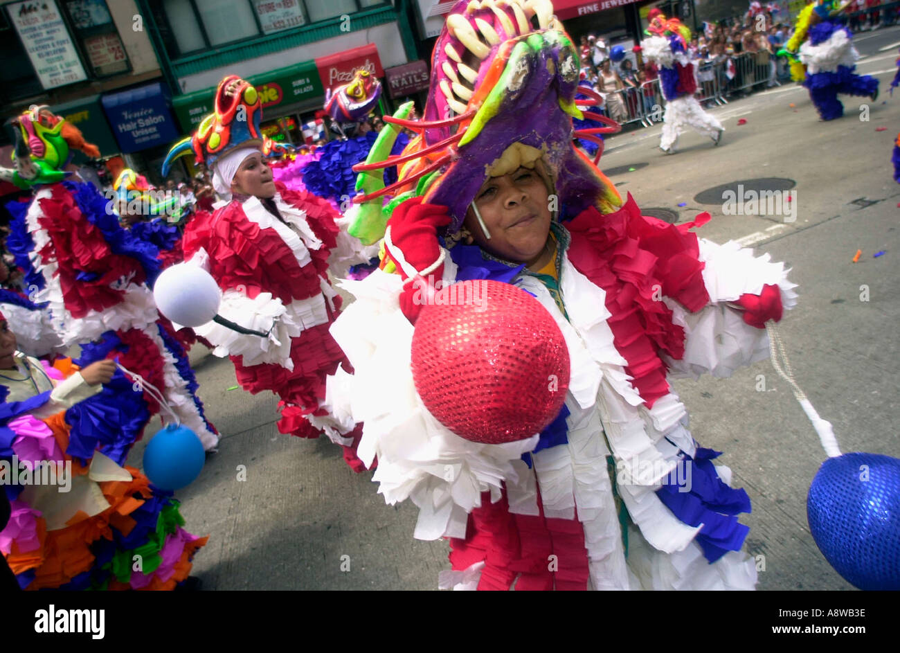 A costumed folk dancing child marches in the 22nd Annual Dominican Day ...
