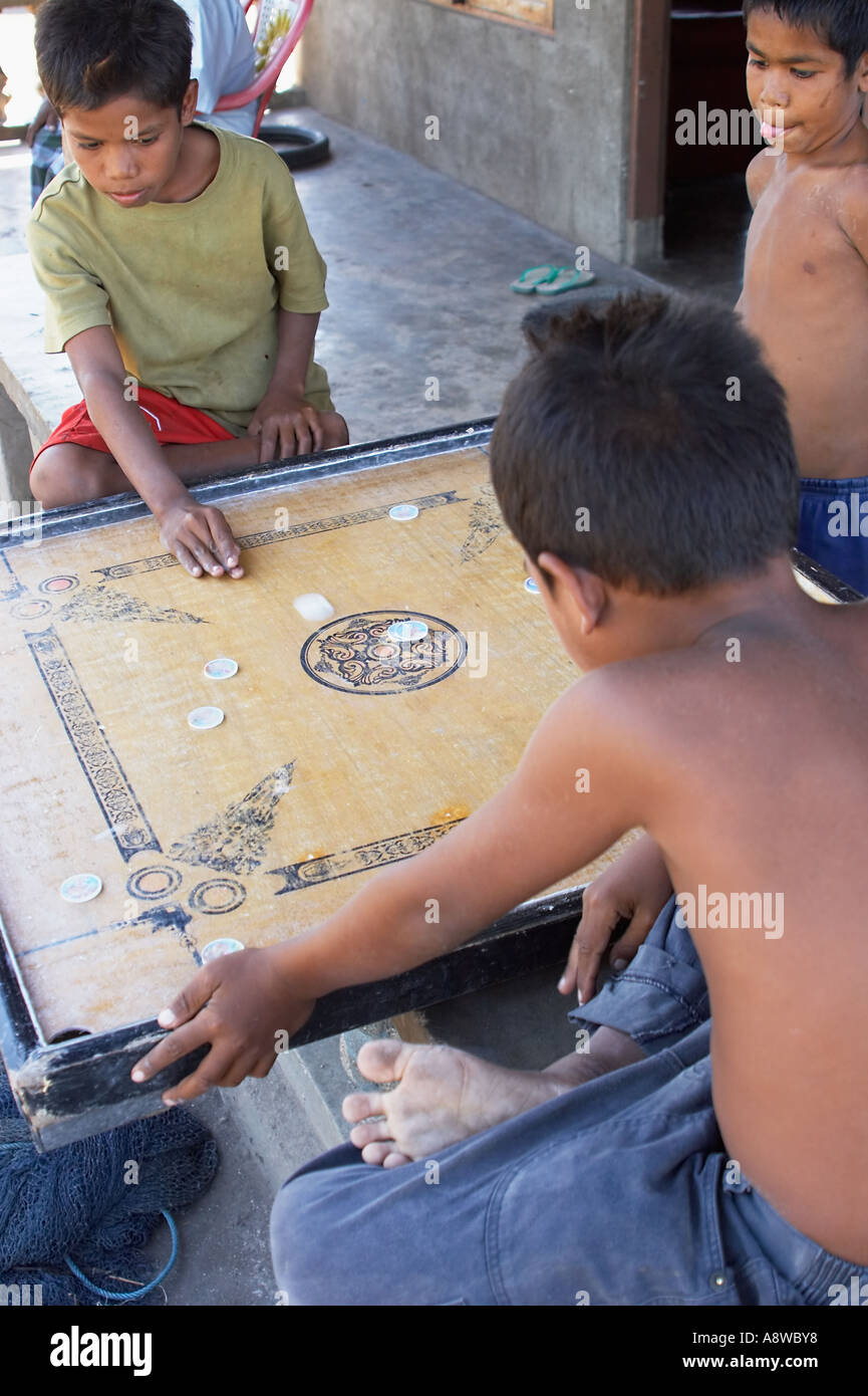 Boys Playing Board Game Stock Photo - Alamy