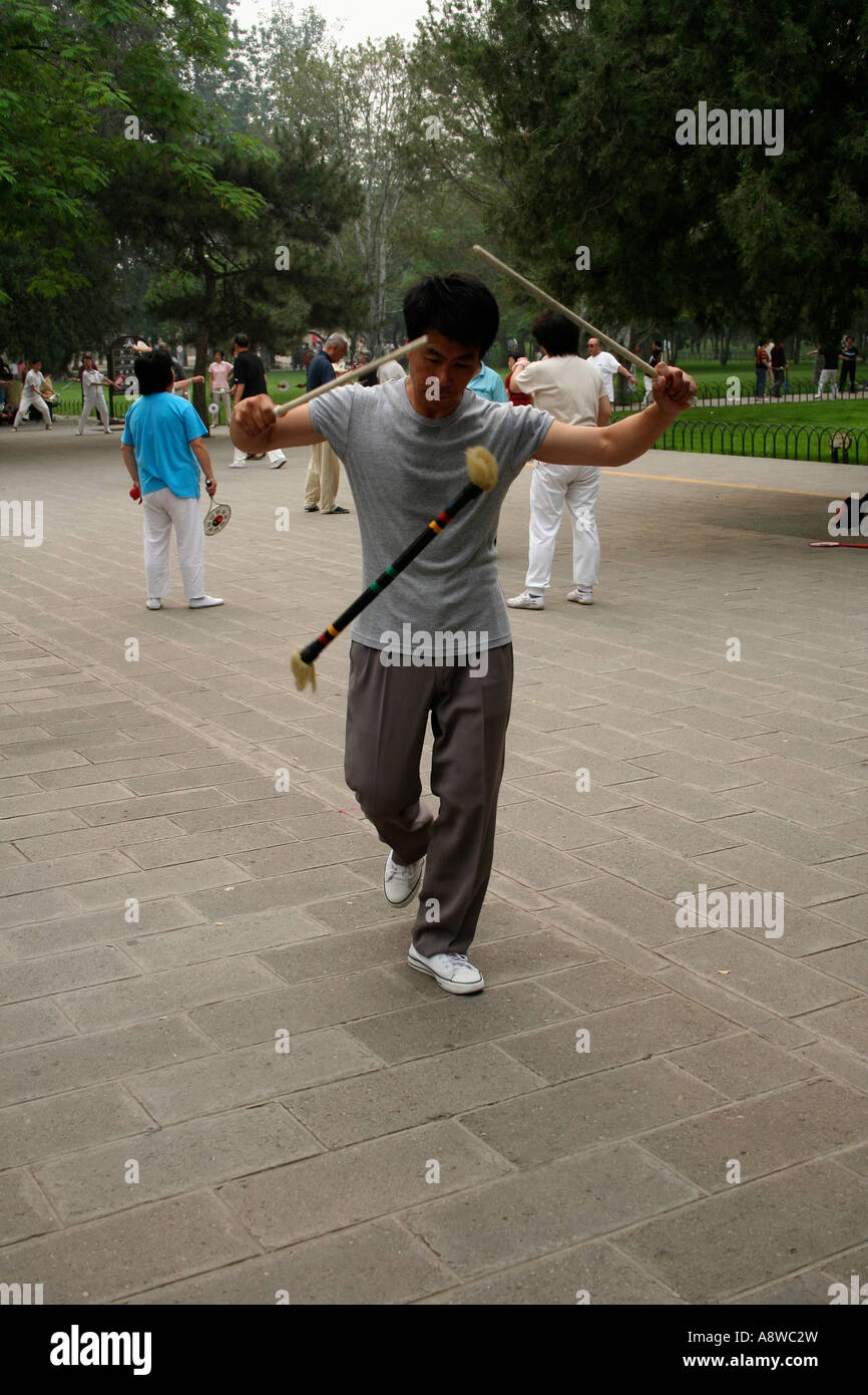 Young Chinese Man dancing and performing at the Summer Palace Park ...