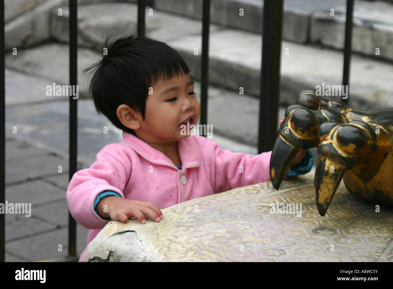 Child Touching Statue High Resolution Stock Photography and Images - Alamy