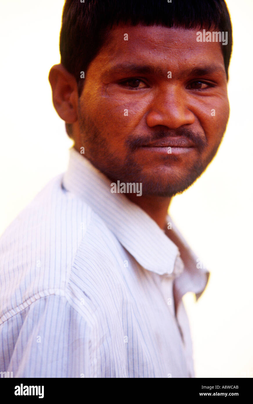 Portrait of a dark skinned Indian man with a short musquash and closely ...