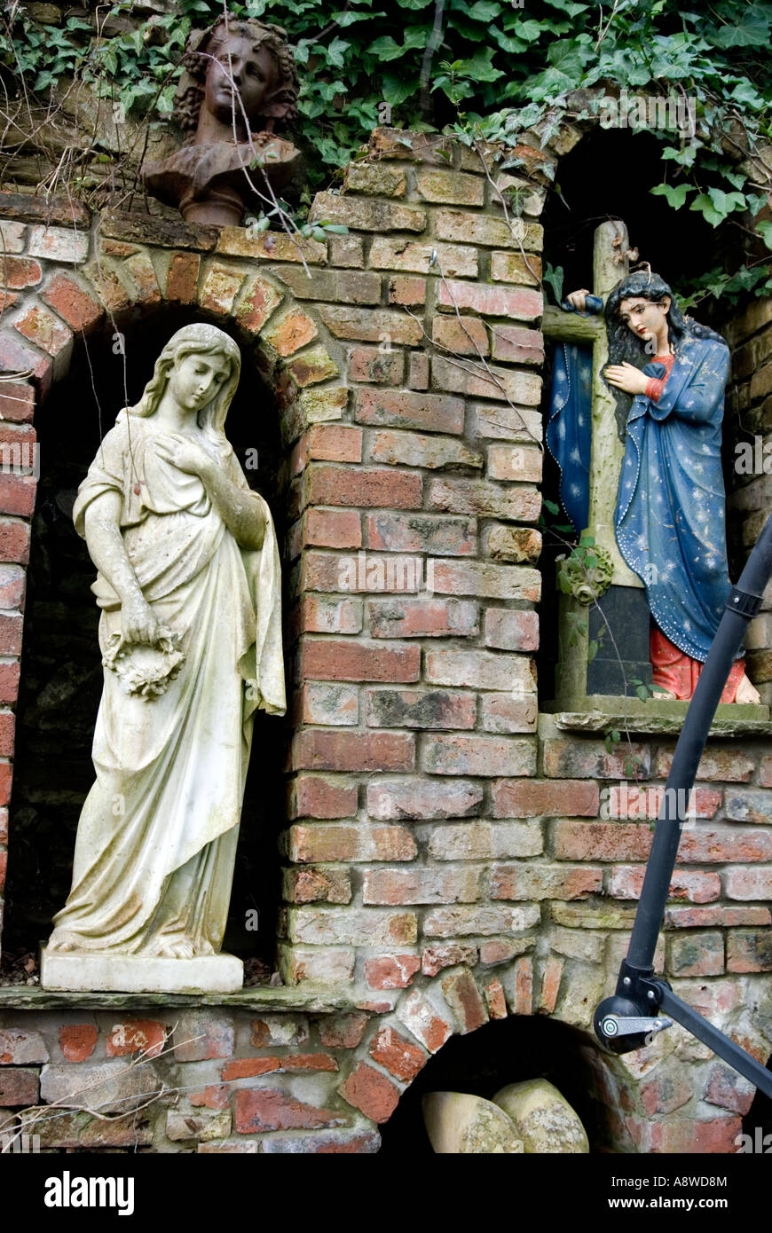 Two or three statues in a garden Stock Photo - Alamy