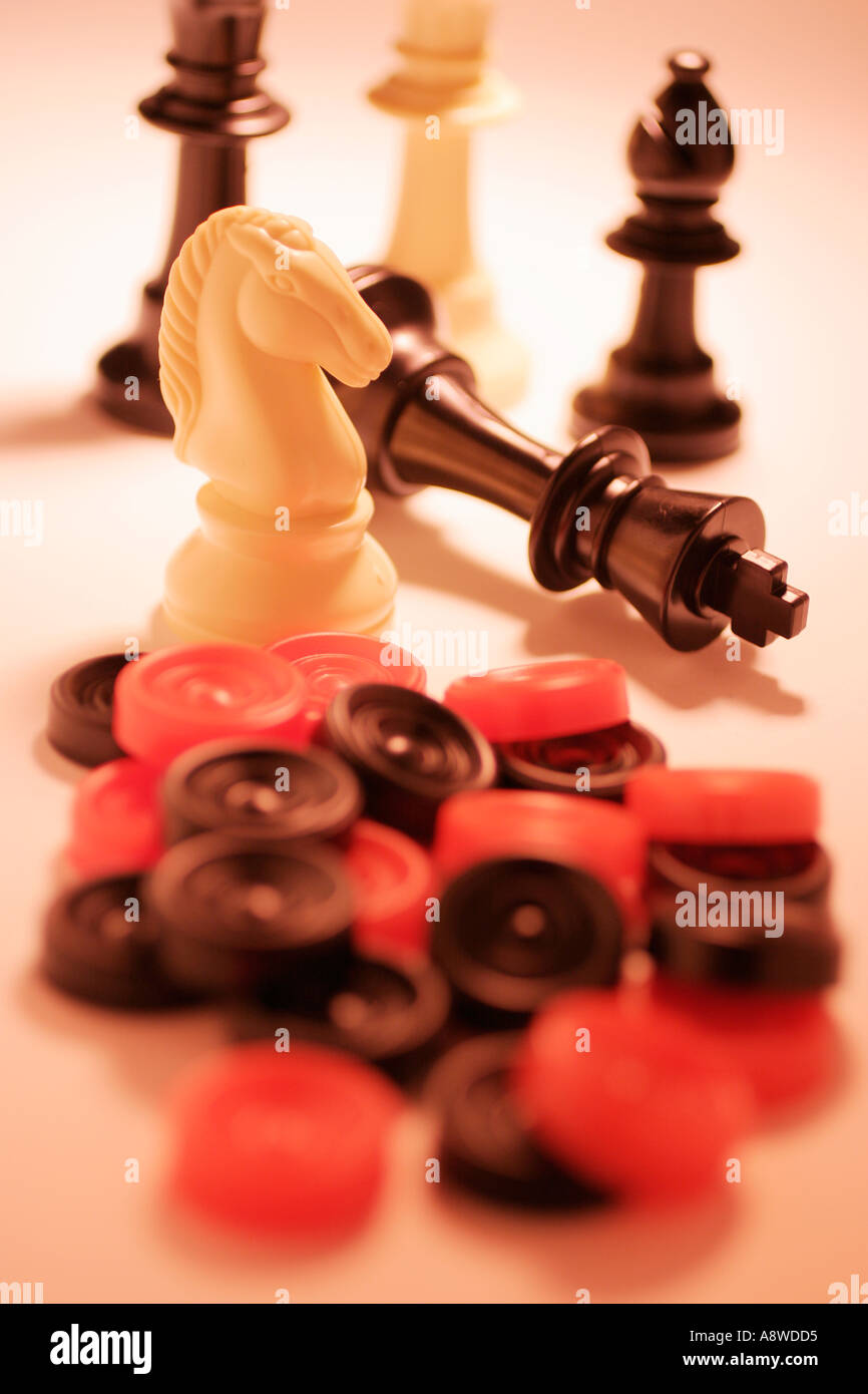 Checkers and Chess Pieces Stock Photo - Alamy