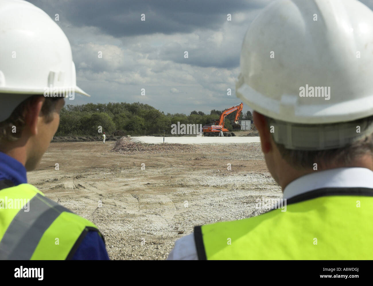 Two construction men working on site Stock Photo - Alamy