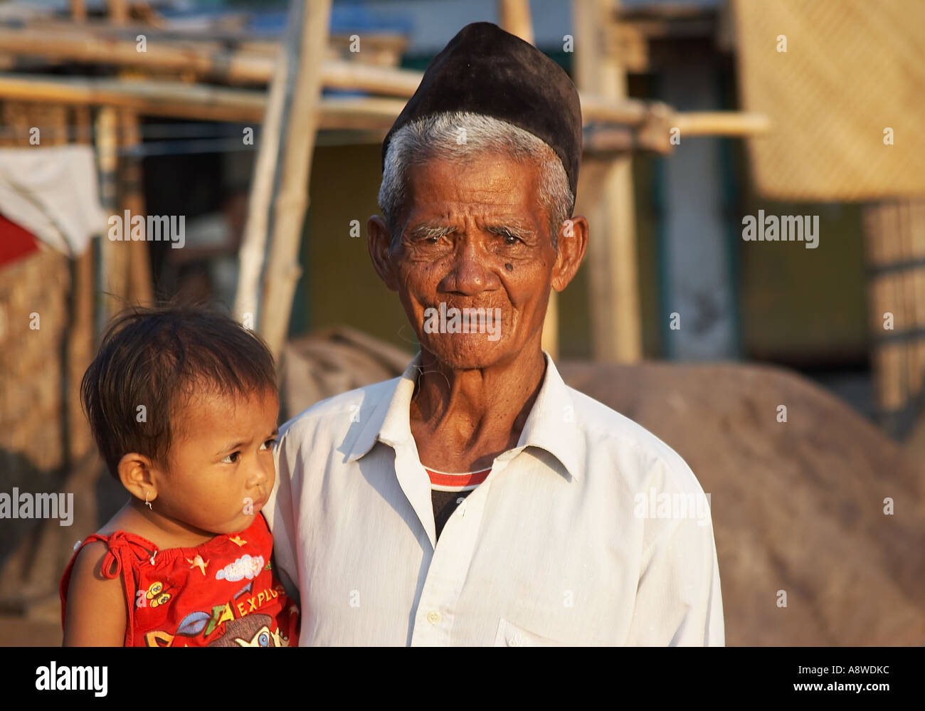 Old Man Holding Child Stock Photo - Alamy