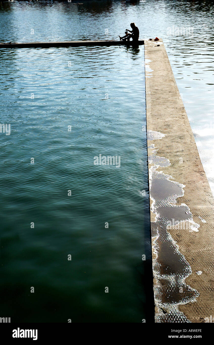 Silhouette indian priest bathing hi-res stock photography and images ...