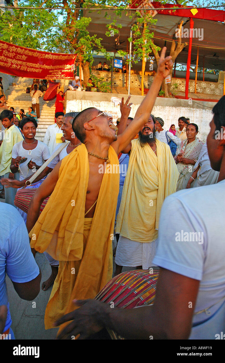 SUB90513 Many Indian devotees dancing and singing religious songs ...